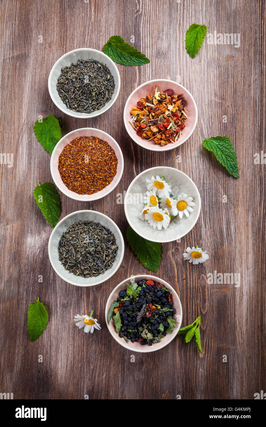 Assortment of dry tea in bowls Stock Photo - Alamy