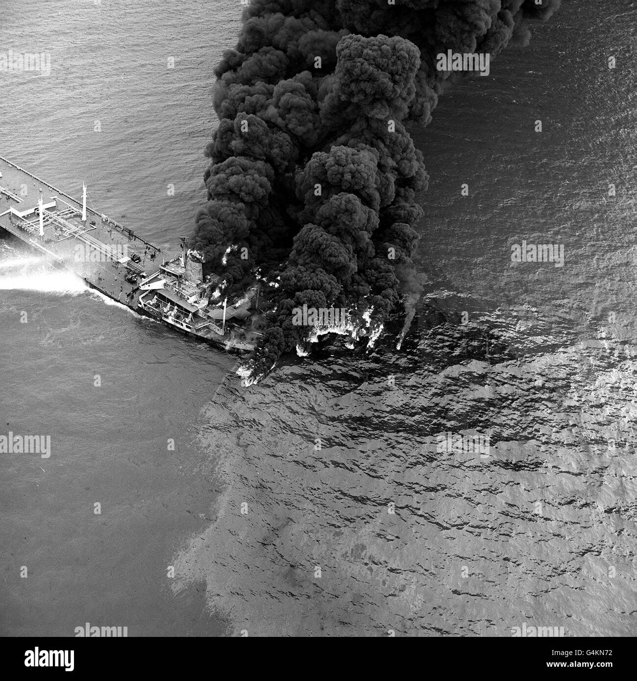 Flames and smoke coming from the stern of the oil tanker 'Pacific Glory ...