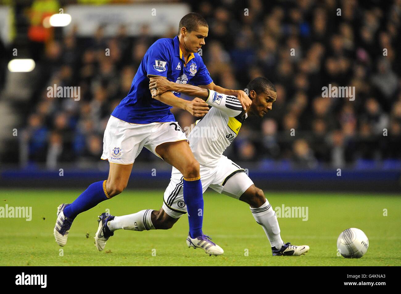 Everton's Jack Rodwell and Chelsea's Florent Malouda (right) battle for ...