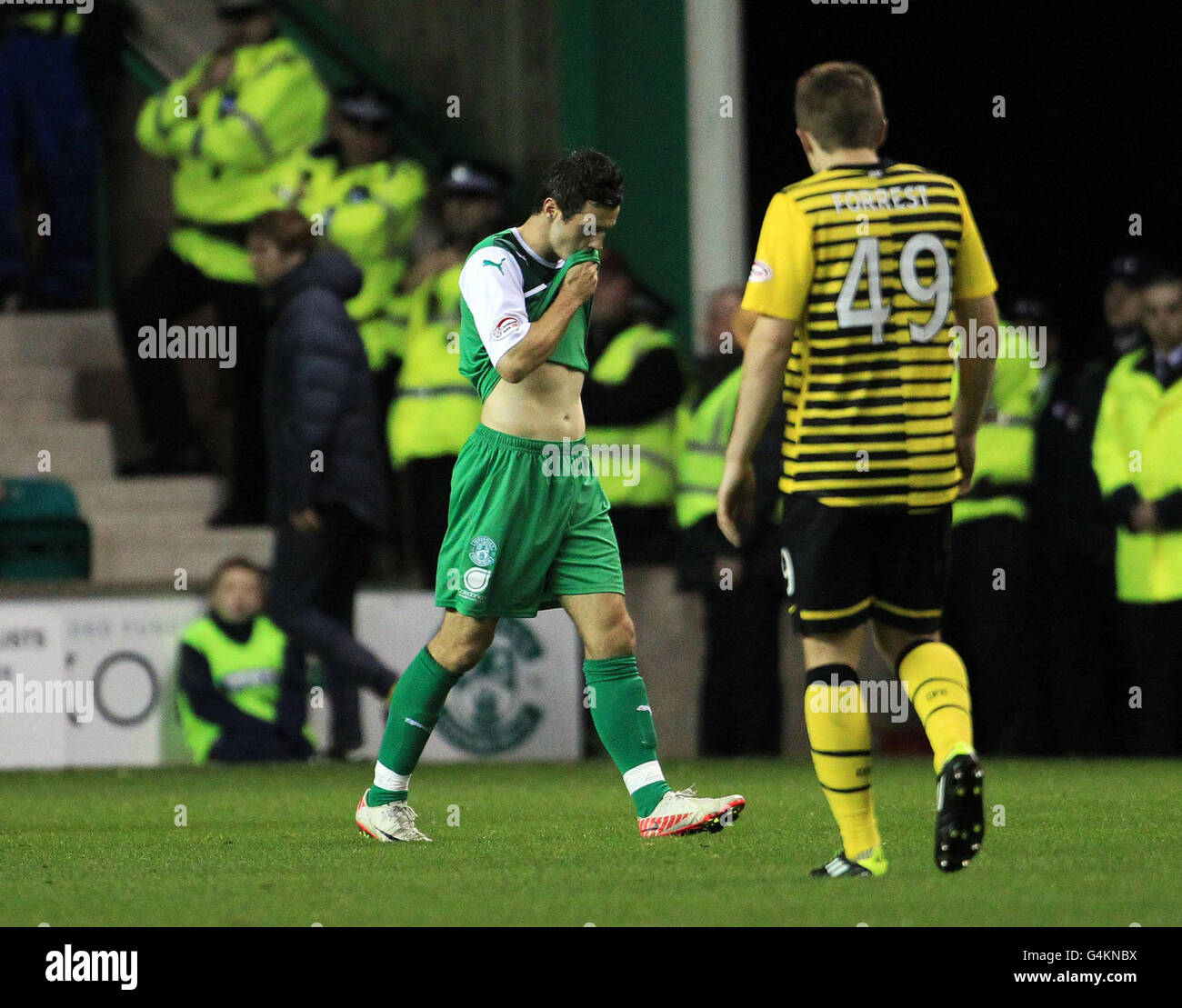 Hibernian's Ivan Sproule reacts after he is sent off by referee, Willie ...