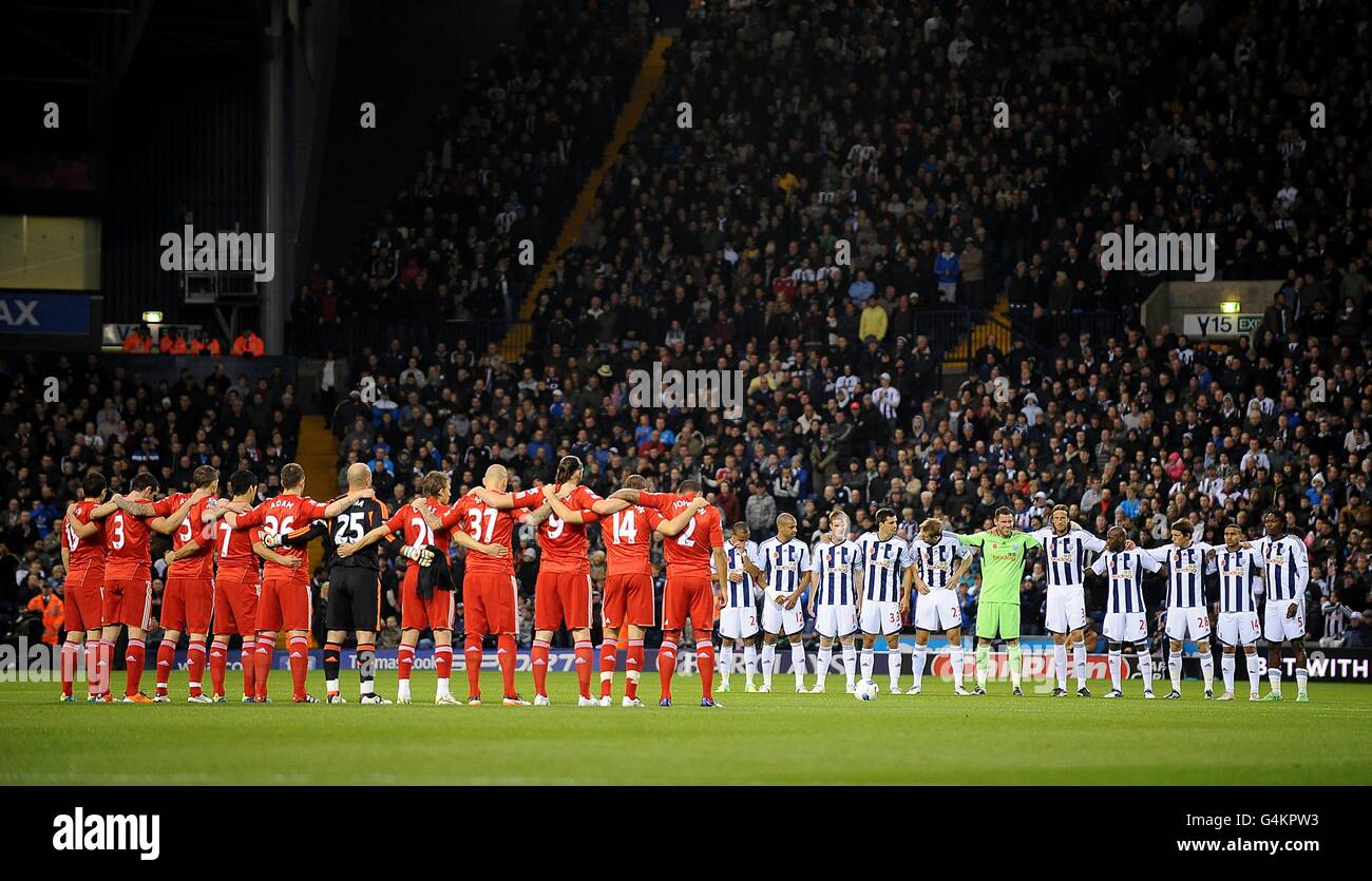 West Bromwich Albion and Liverpool players observe a minute's silence ...