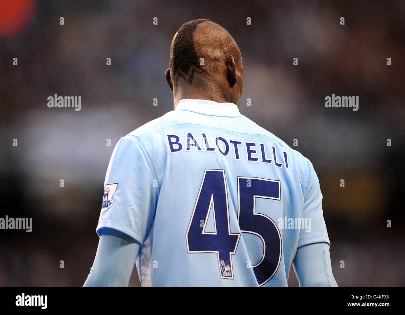 Manchester citys mario balotelli shows of his new haircut hi-res stock ...