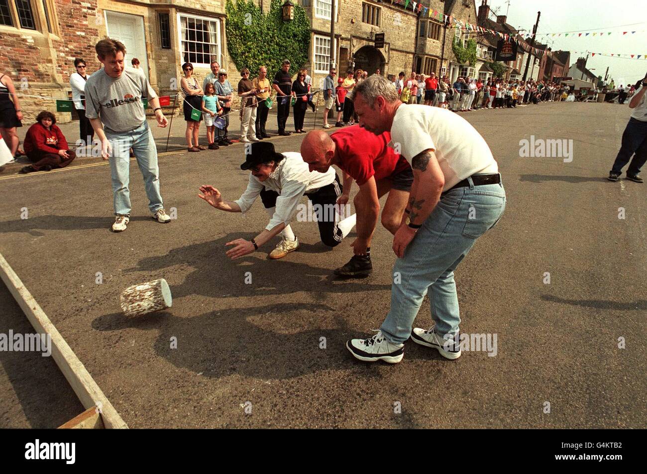 Participants take part in the traditional May Day "Stilton cheese ...