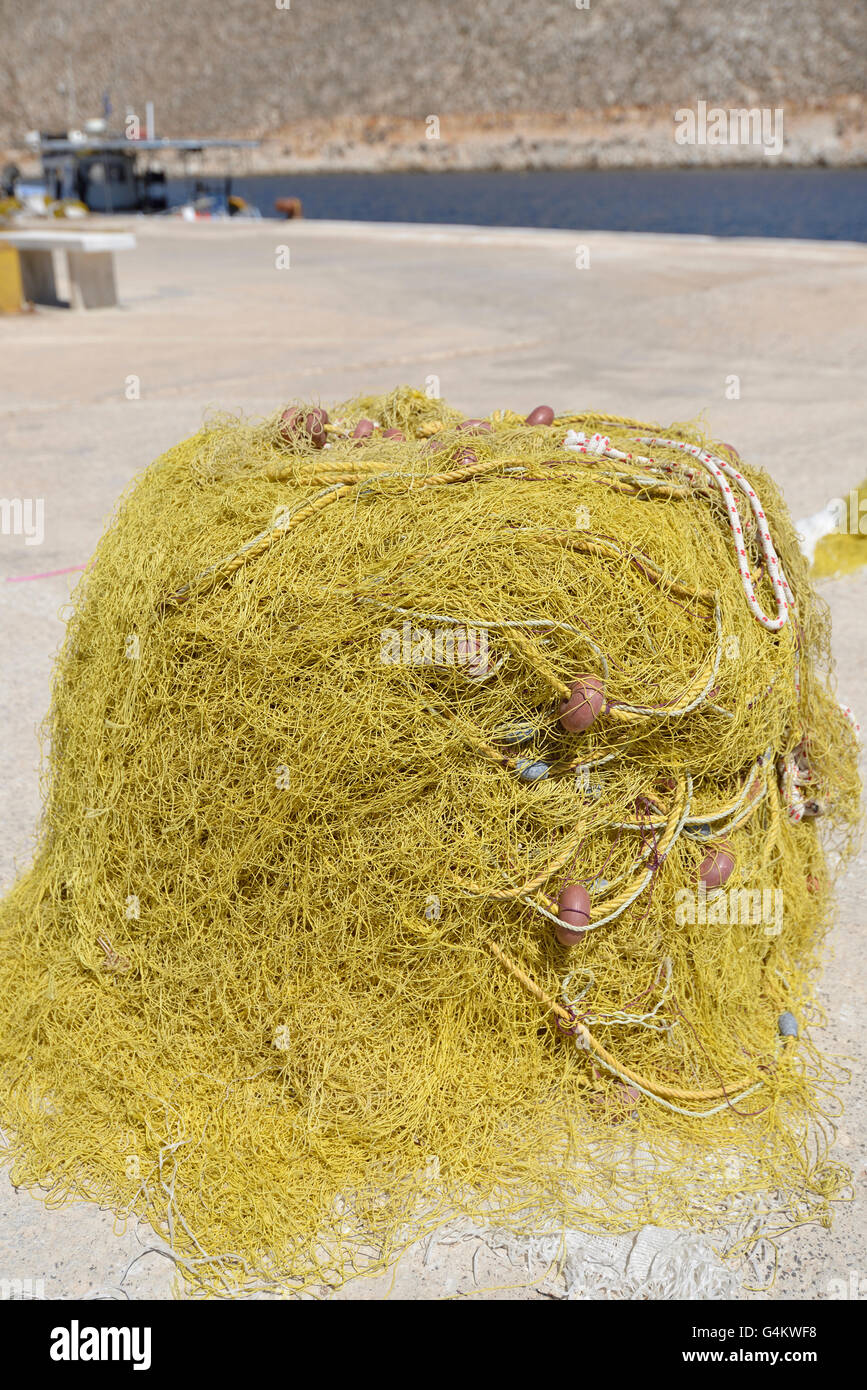 Pile of fishing nets at Panormos port in Tinos island, Greece Stock ...