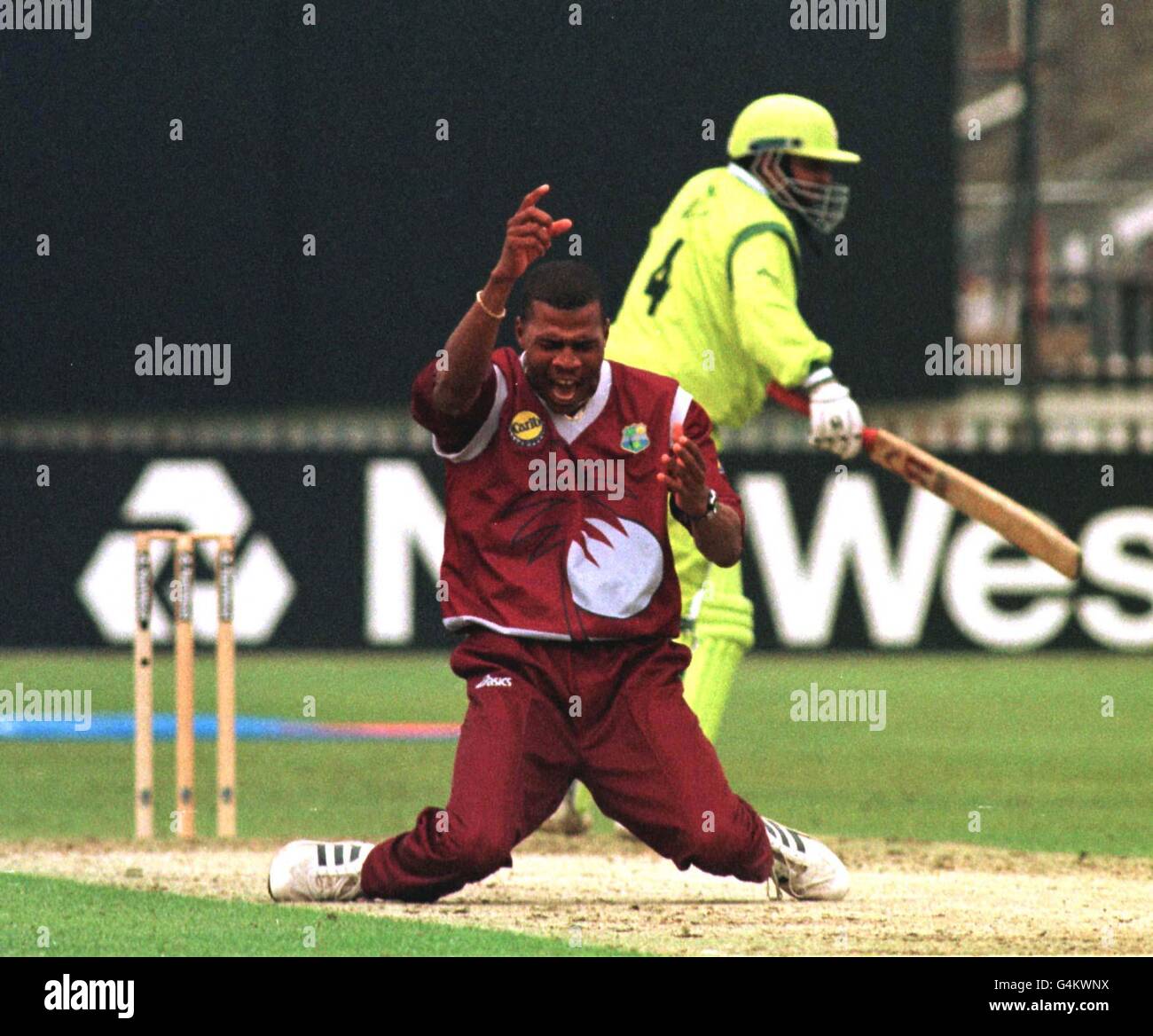 Mervyn Dillon (West Indies) celebrates getting the wicket of Ijaz Ahmed ...