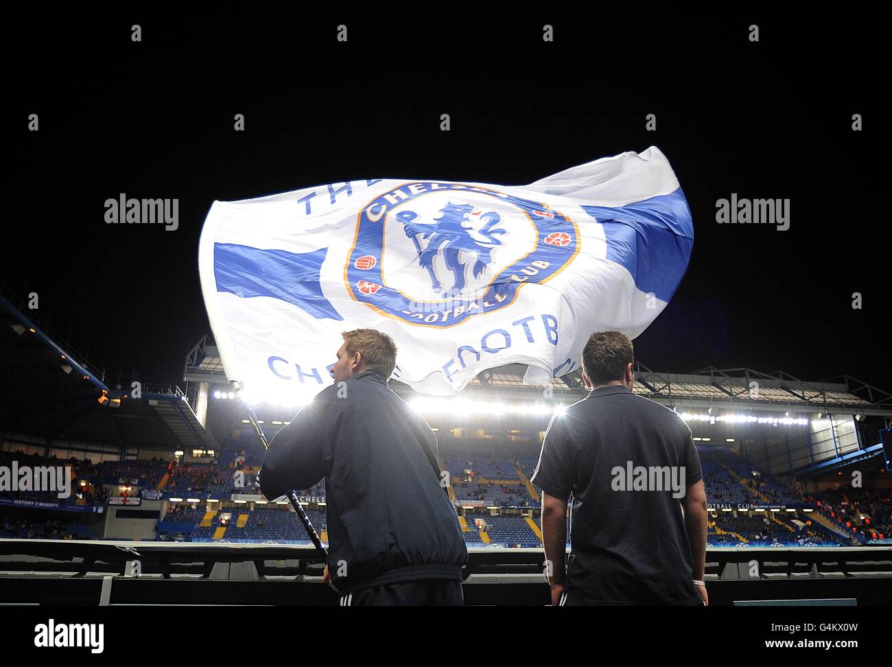 A giant chelsea flag is waved in the stadium hi-res stock photography ...
