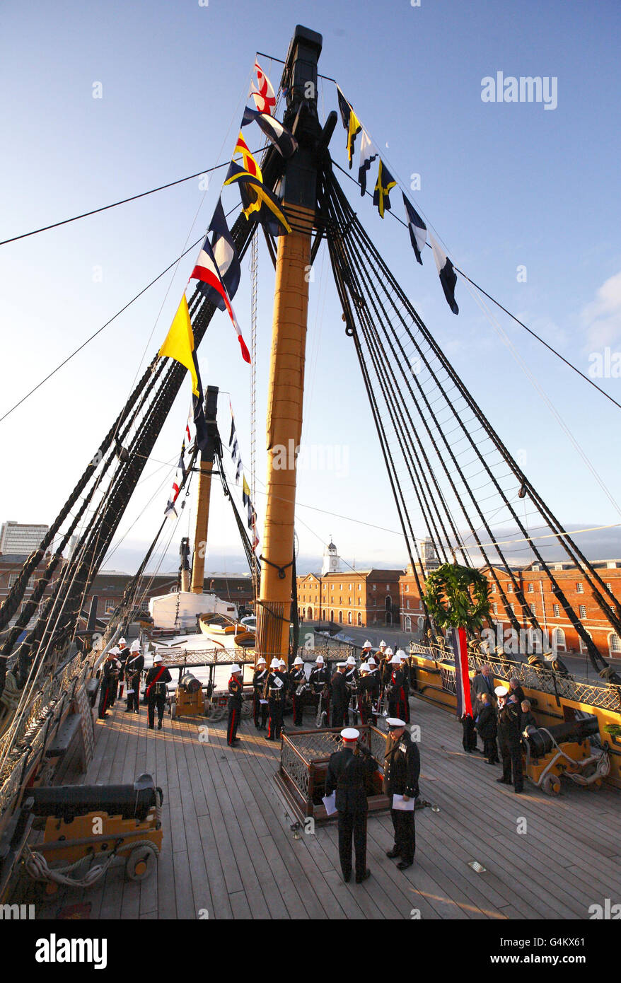 Senior Royal Navy officers begin to gather on the deck of HMS Victory ...