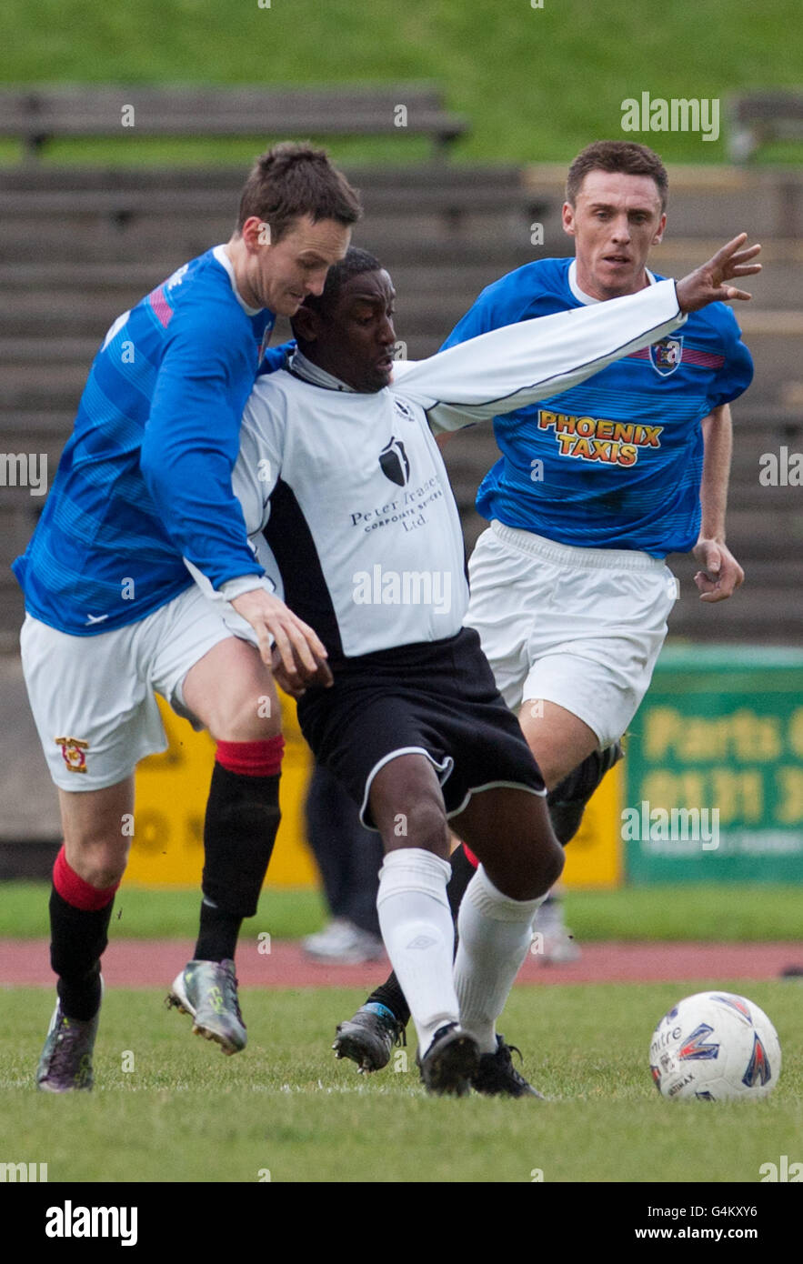Russell Latapy of Edinburgh City is fouled by Irvine Meadow's David ...