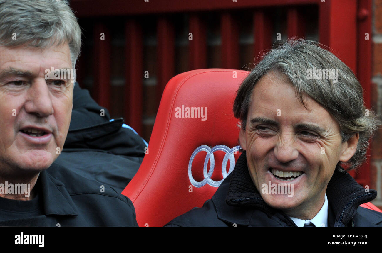 Manchester city manager roberto mancini his assistant brian kidd right ...