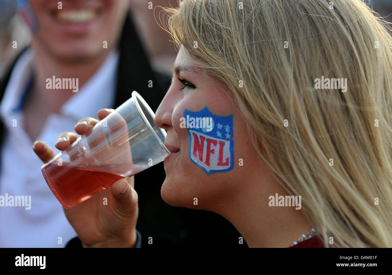 An NFL fan enjoy a drink in the 'Tailgate Party before the NFL ...