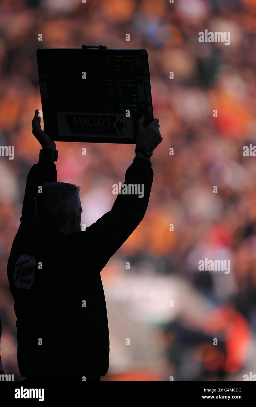 The fourth official holds up a substitution sign hi-res stock ...