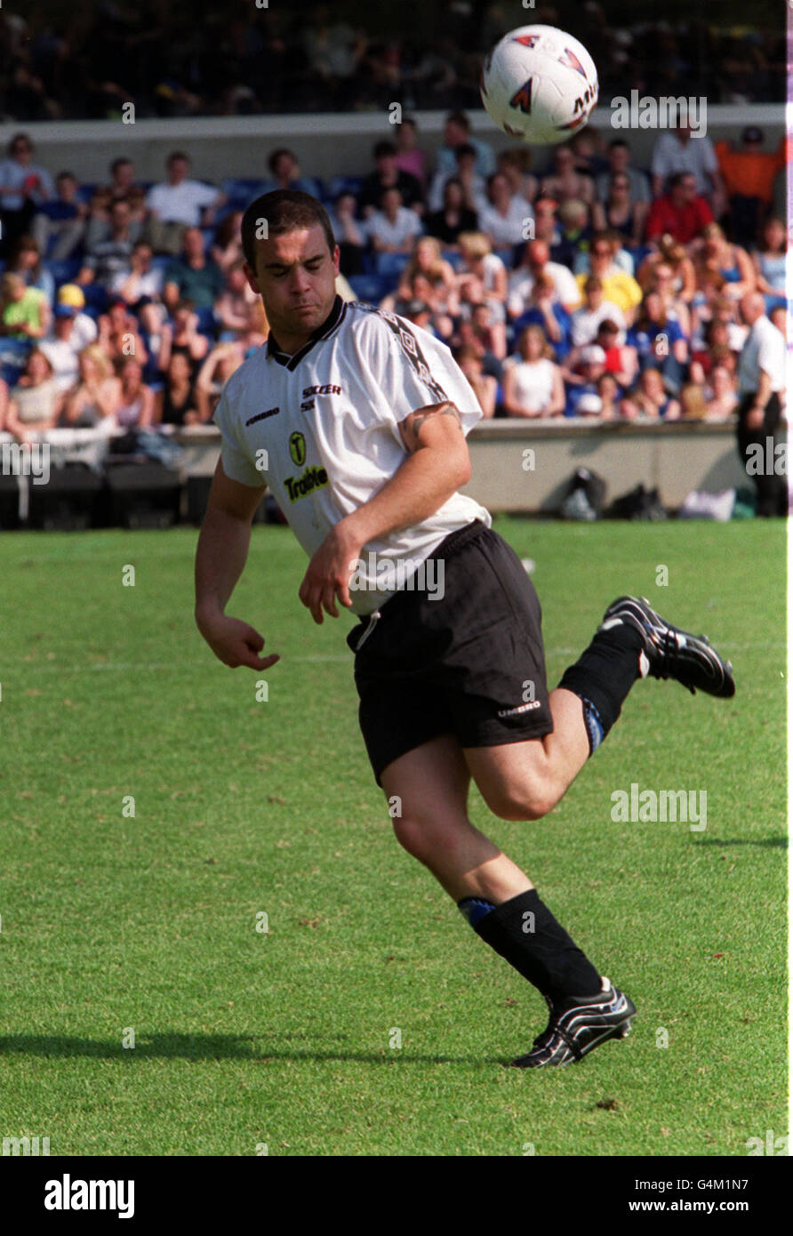 Singer Robbie Williams in action, during the Music Industry Soccer Six ...