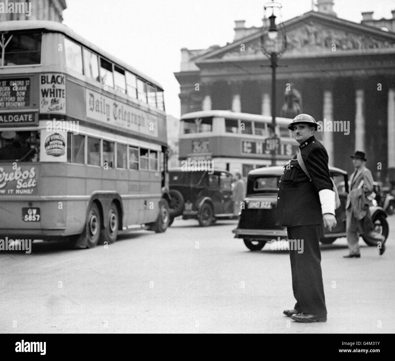 A steel-helmeted policeman on duty at the Bank traffic intersection in ...