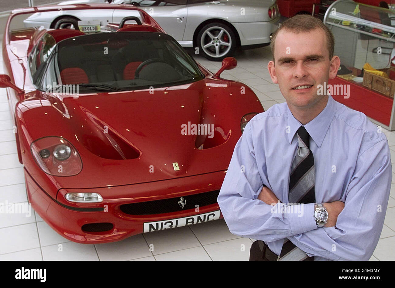 Richard Roger, who works at Stratstone of Wilmslow, selling Ferrari's ...