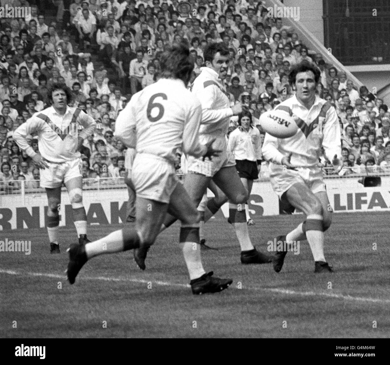St. Helens' stand off Billy Benyon (No.6) receives the ball during the ...