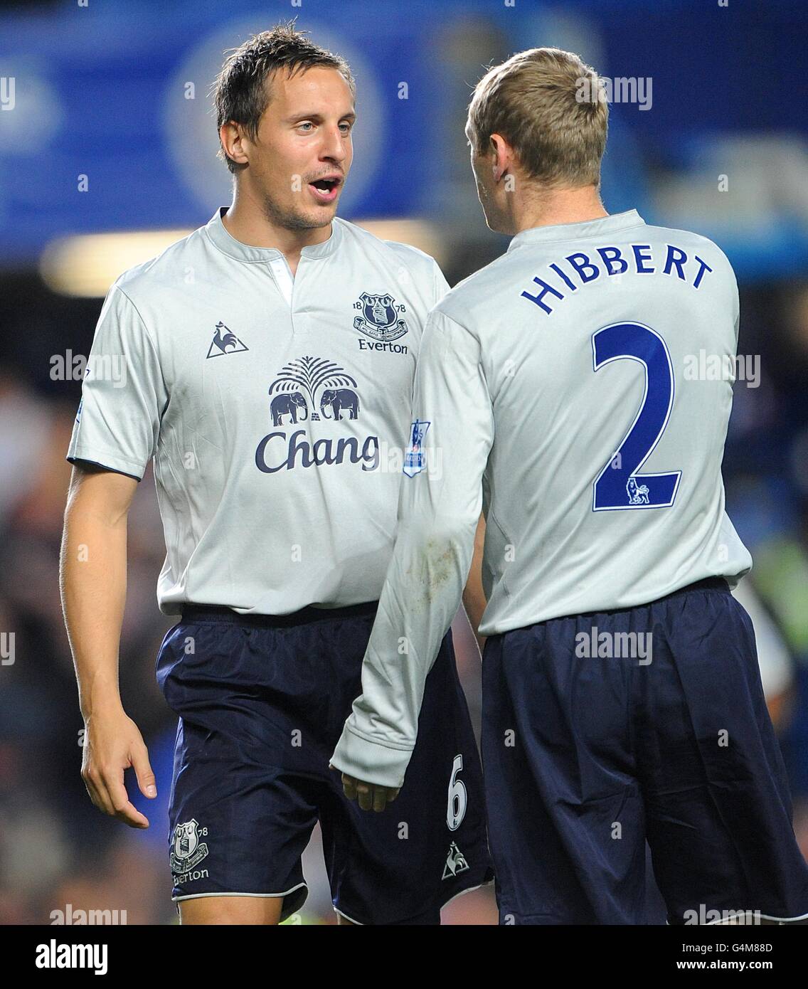 Everton's Tony Hibbert (right) has a chat with team-mate Phil Jagielka ...