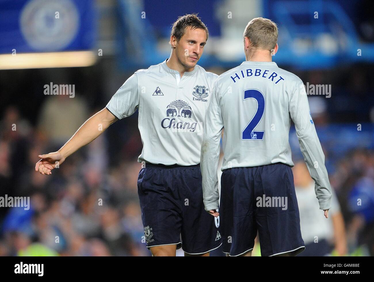 Everton's Tony Hibbert (right) has a chat with team-mate Phil Jagielka ...