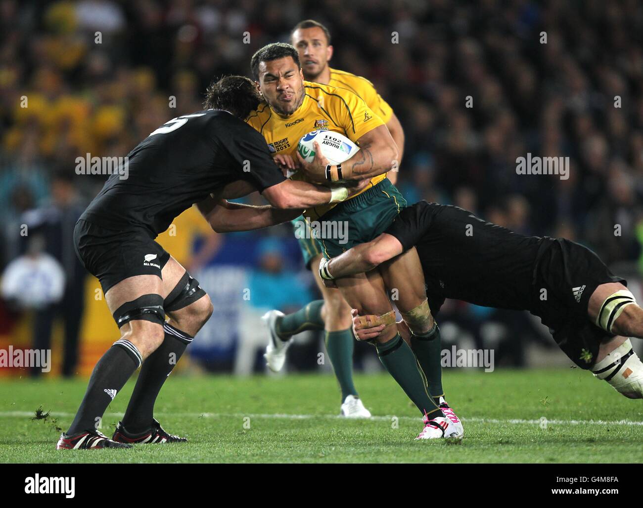 New Zealand's Sam Whitelock (left) and Richie McCaw (right) bring down ...