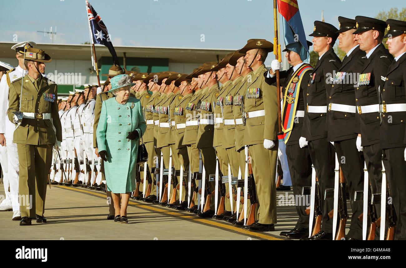 Queen Elizabeth II inspects a Guard of Honour, after flying into ...