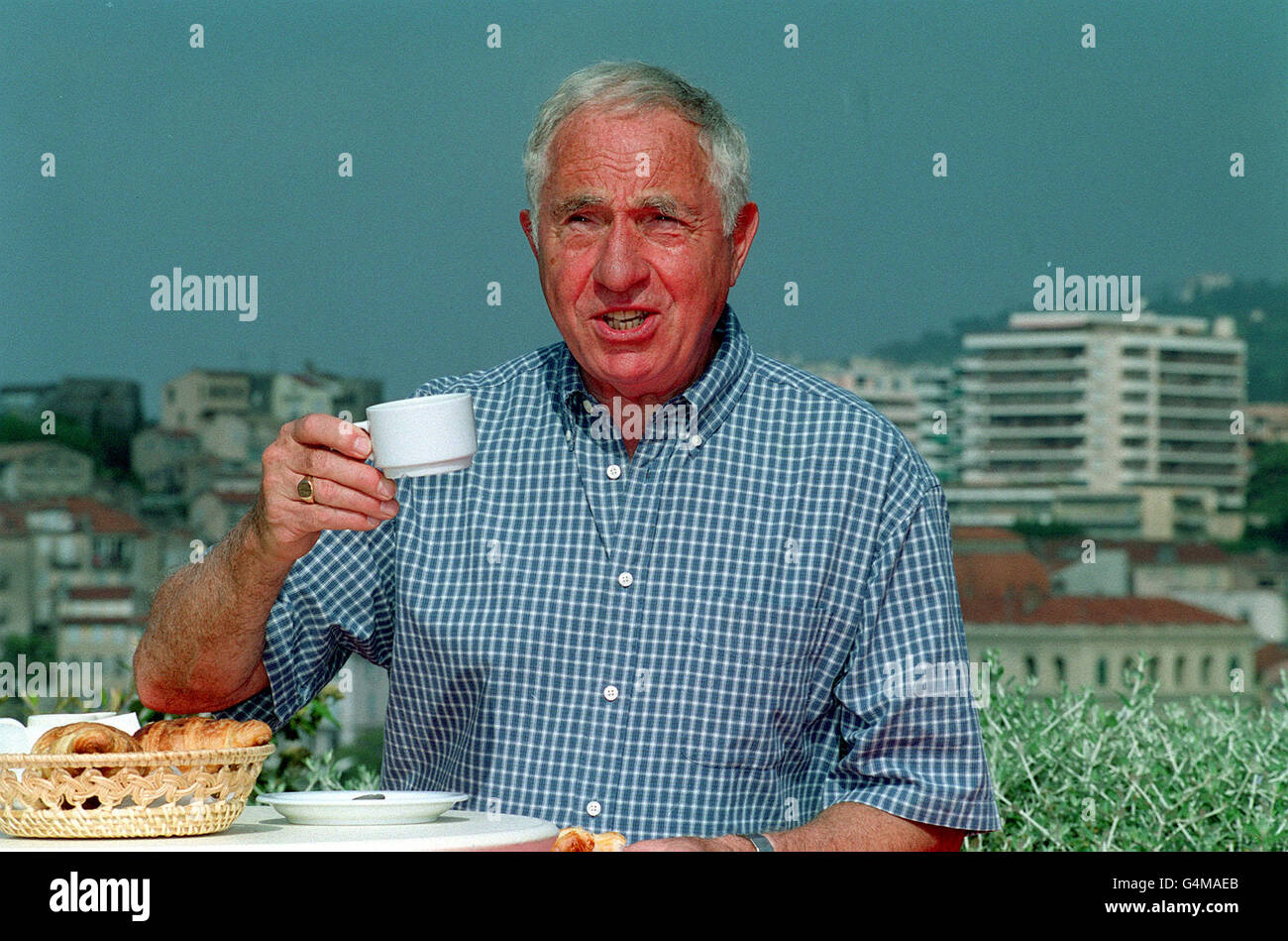 British actor Nigel Hawthorne relaxes at breakfast on the rooftop of ...