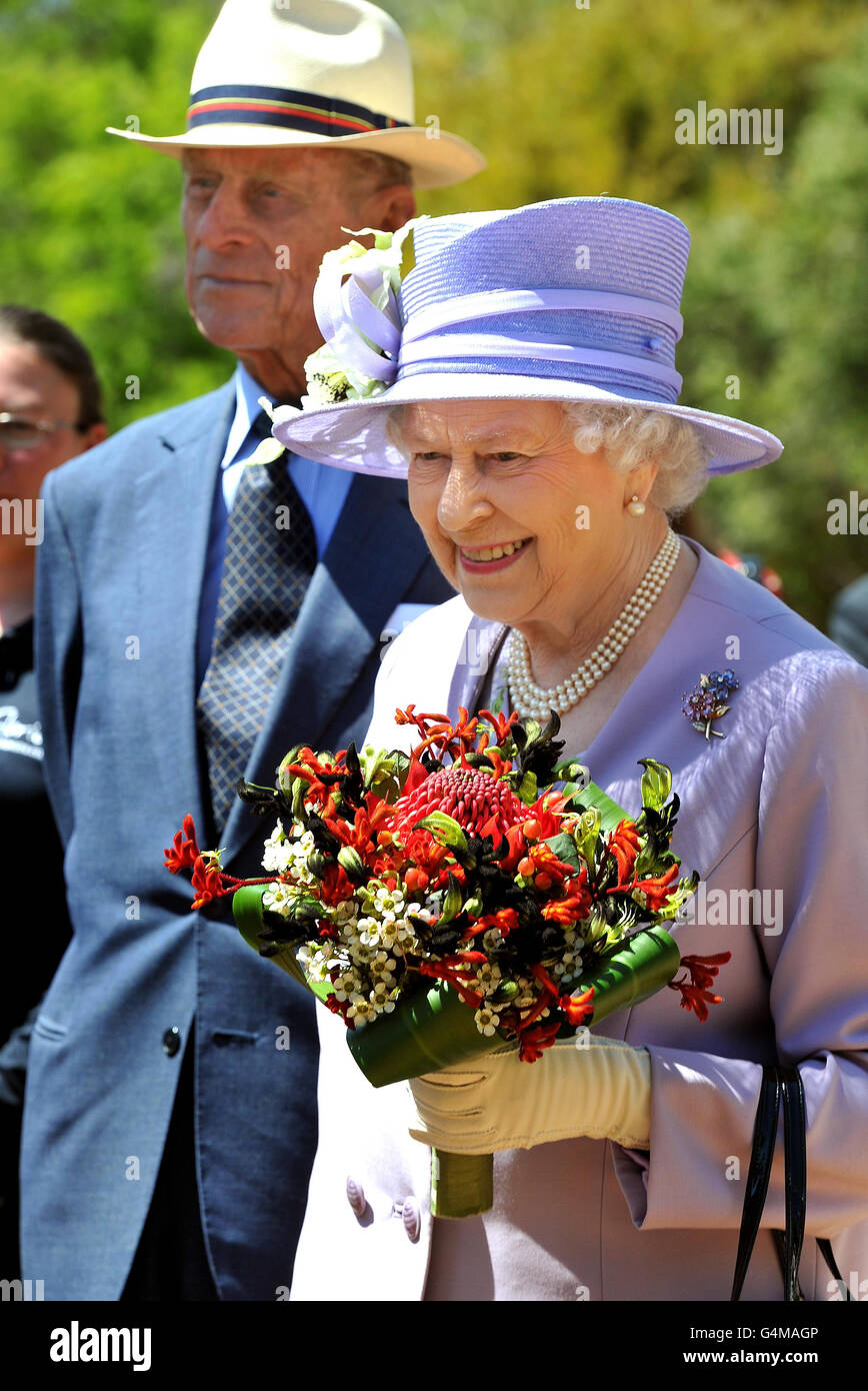 Queen Elizabeth II with the Duke of Edinburgh after being given flowers ...