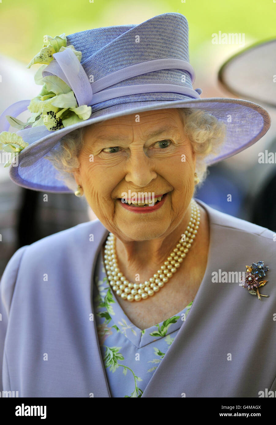 The Queen smiles as she talks to gardeners at the Canberra Floriade ...