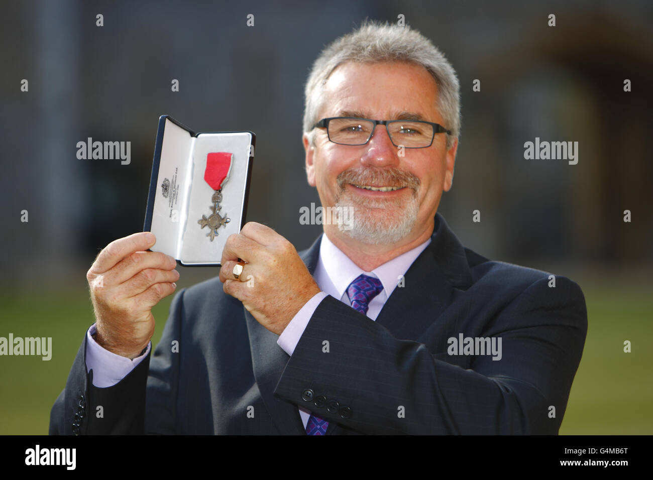 Royal investiture head shot headshot eye contact smiling glasses medal ...