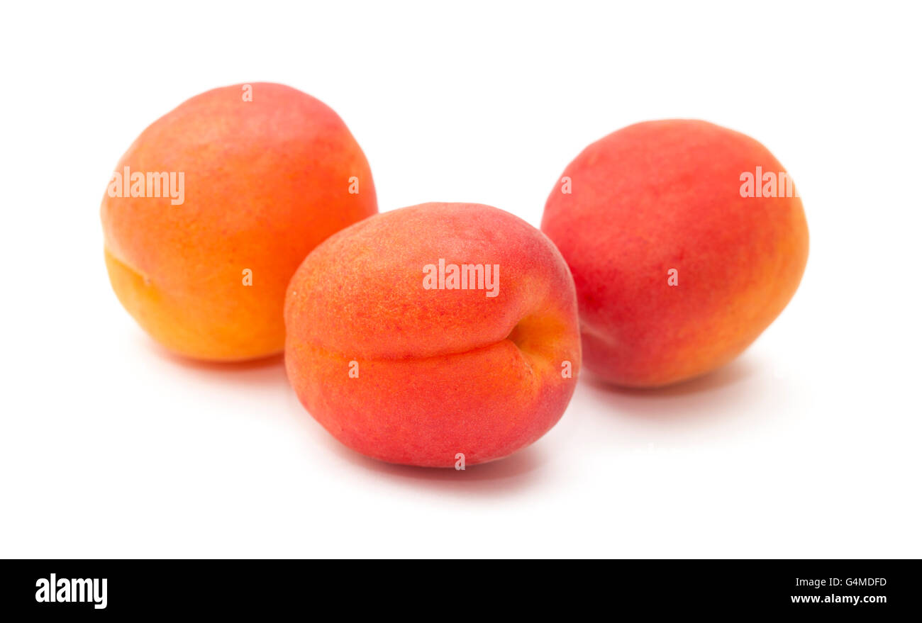 small ripe apricots isolated on white background Stock Photo - Alamy