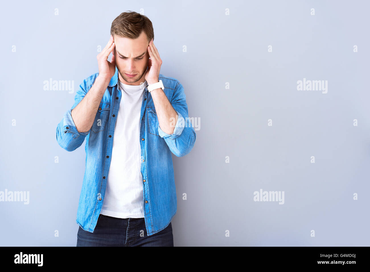 Moody man standing isolated on white background Stock Photo - Alamy
