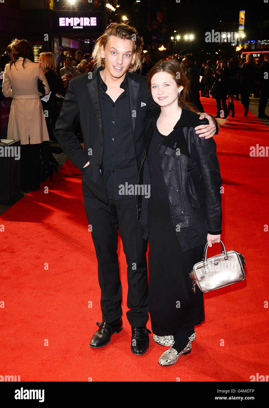 Jamie Campbell Bower (left) and Bonnie Wright arrive for the premiere ...