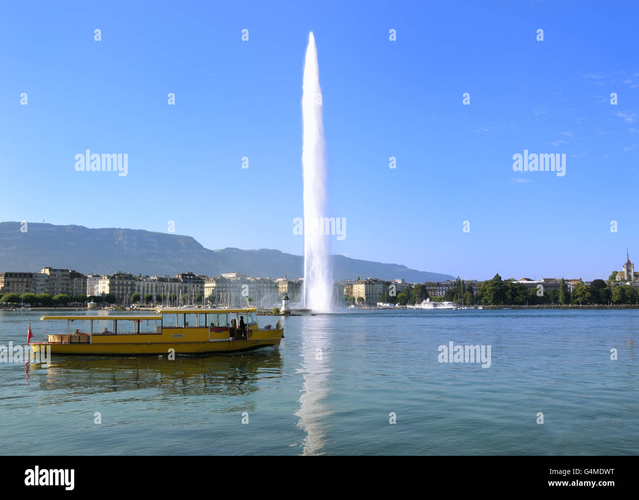 Summer view of Geneva harbor, fountain and water taxi Stock Photo - Alamy