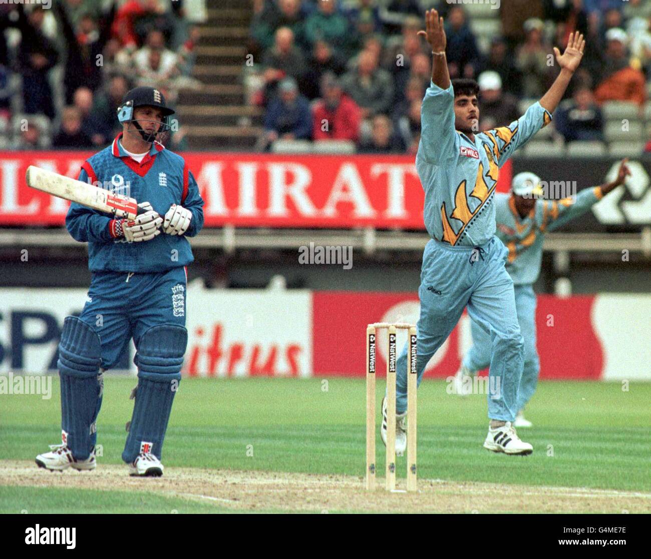 England's Mark Ealham (L) looks depressed as he loses his partner Neil ...