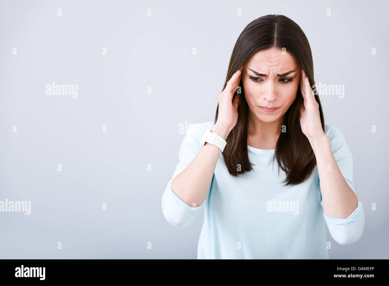 Moody woman standing isolated on white background Stock Photo - Alamy