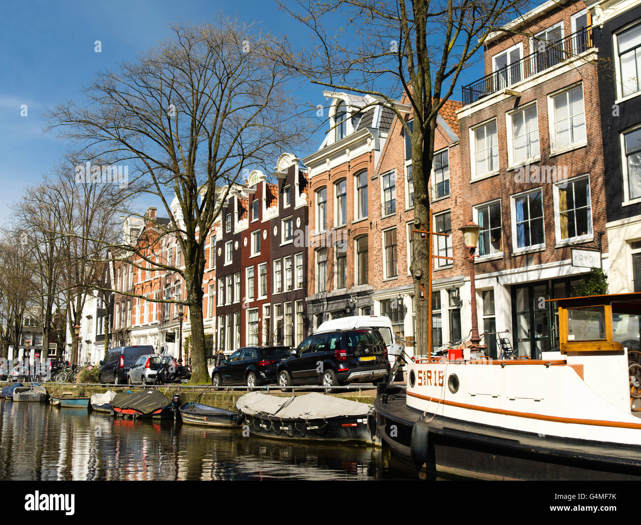A view along one of Amsterdam's many canals on a beautiful spring day ...