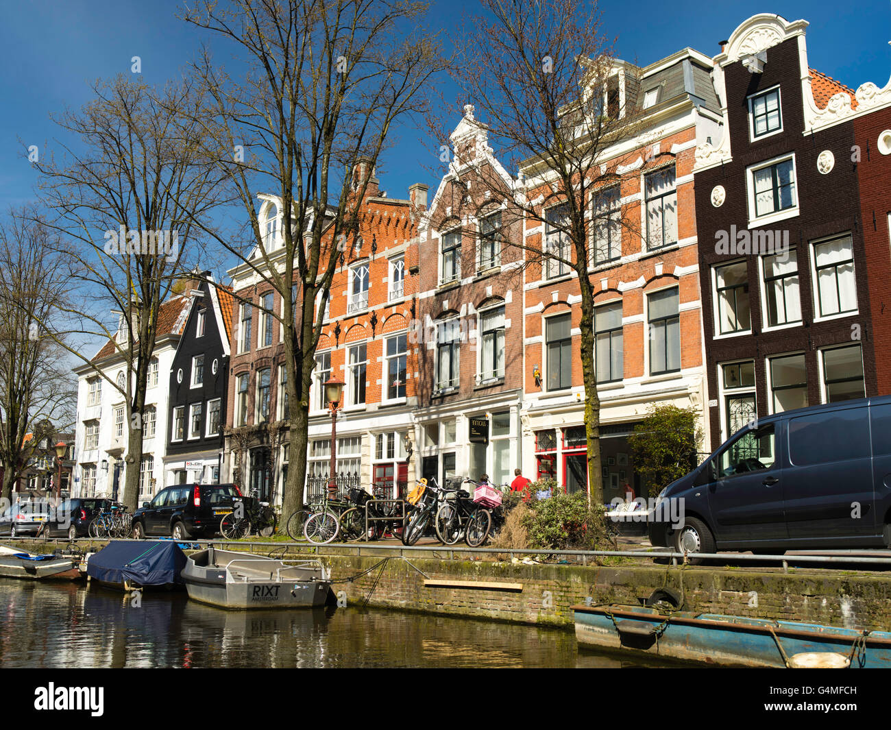 A view along one of Amsterdam's many canals on a beautiful spring day ...
