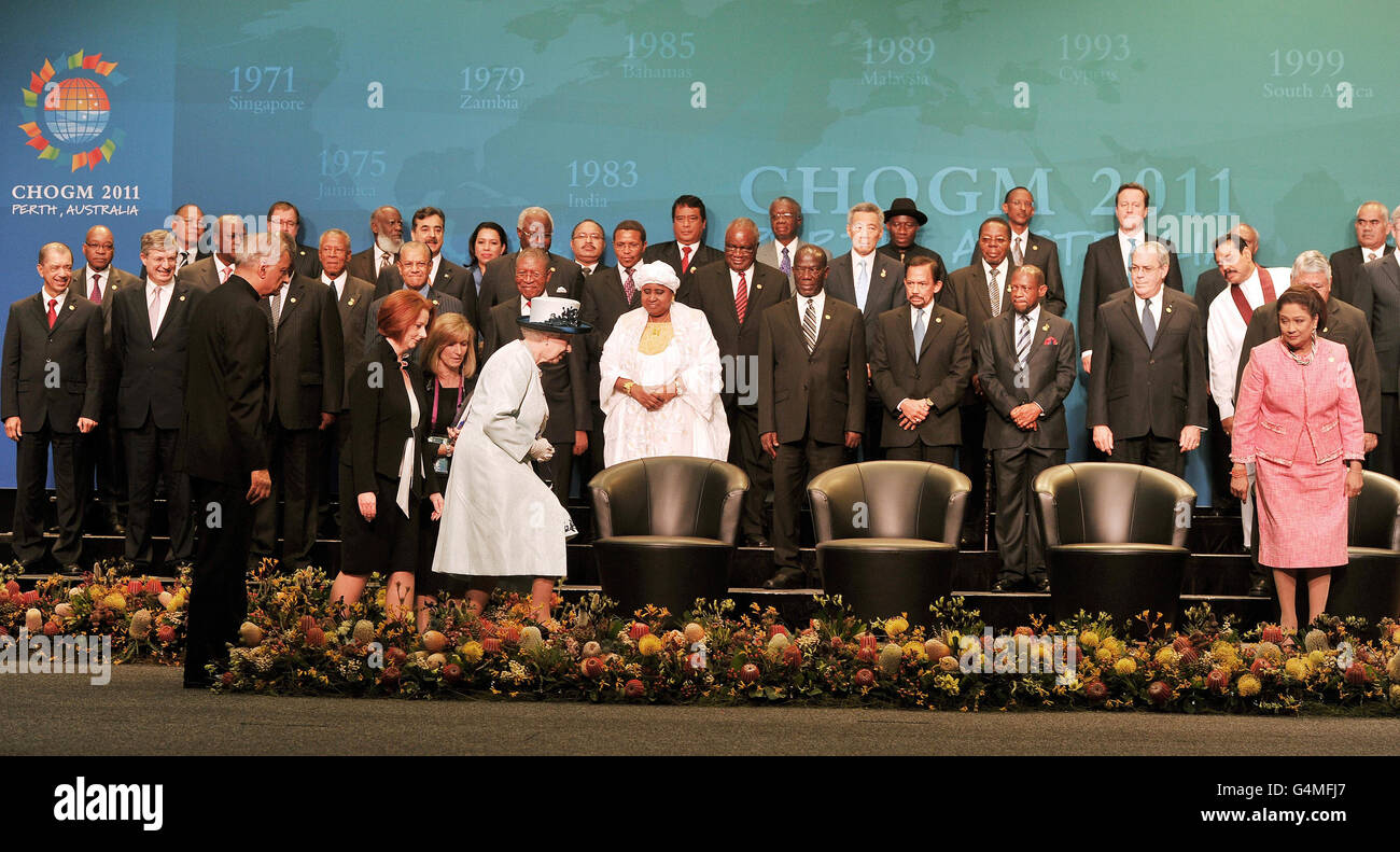 Australian Prime Minister Julia Gillard follows Queen Elizabeth II as ...