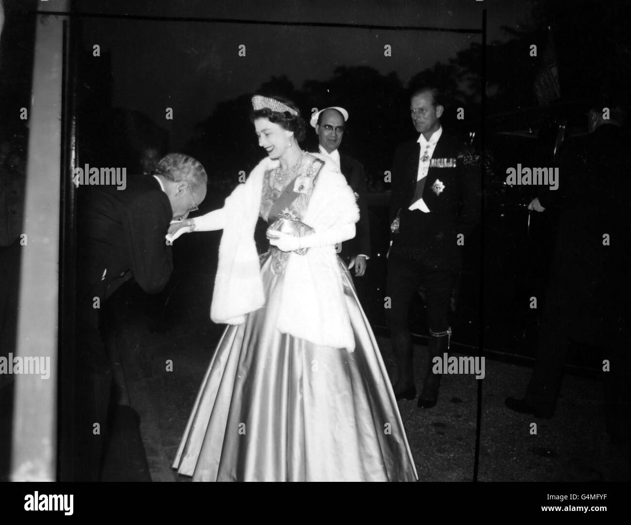 **Scanned low-res off contact** The traditional greeting of a kiss on ...