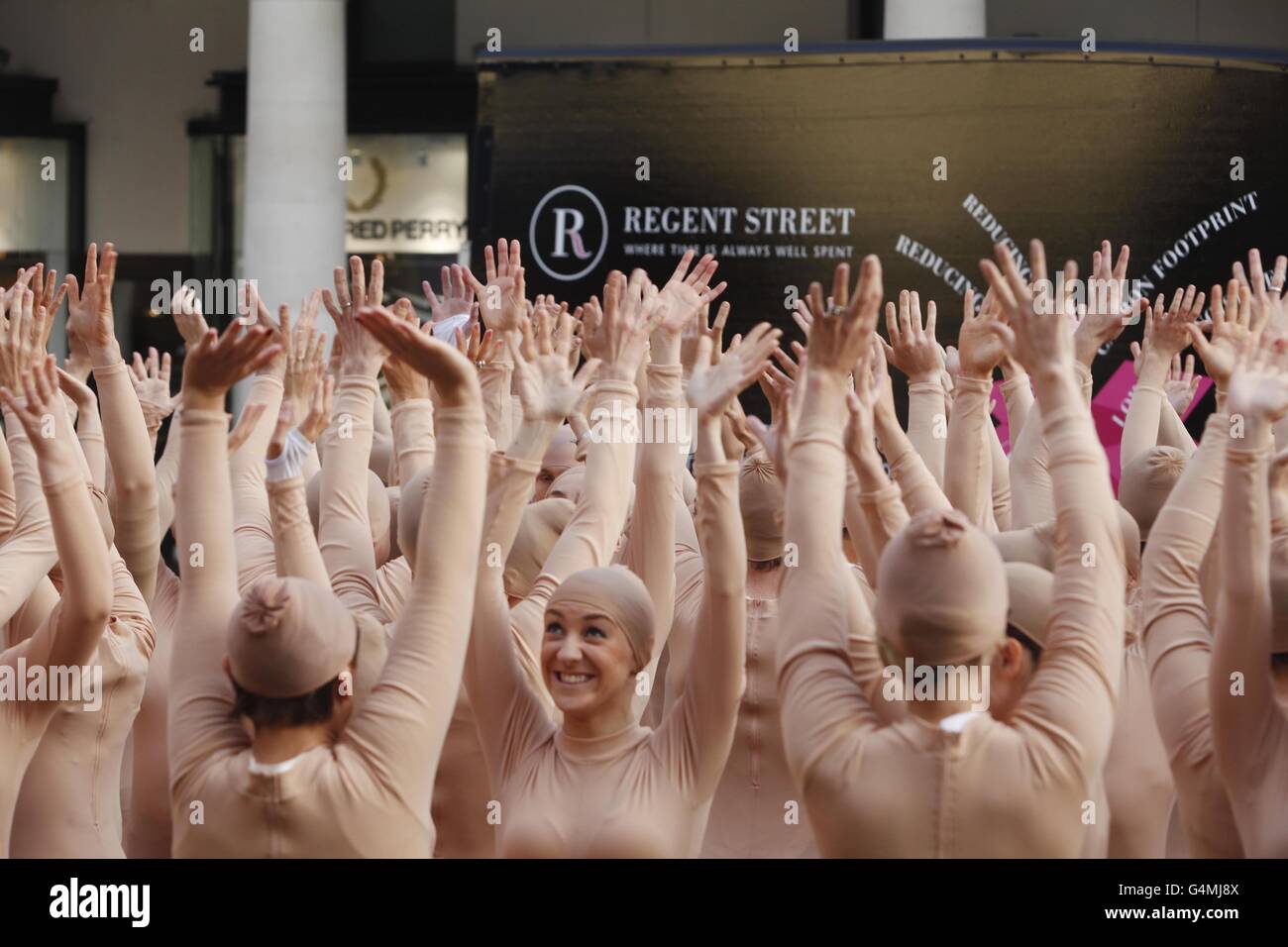 A giant human hand is formed by 200 in London's Covent Garden to ...