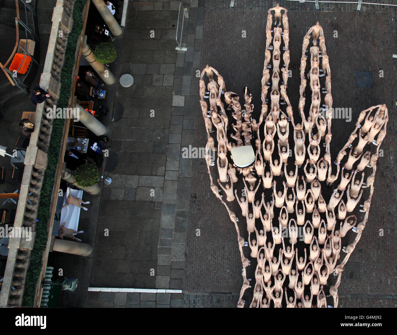 A giant human hand is formed by 200 in London's Covent Garden to ...
