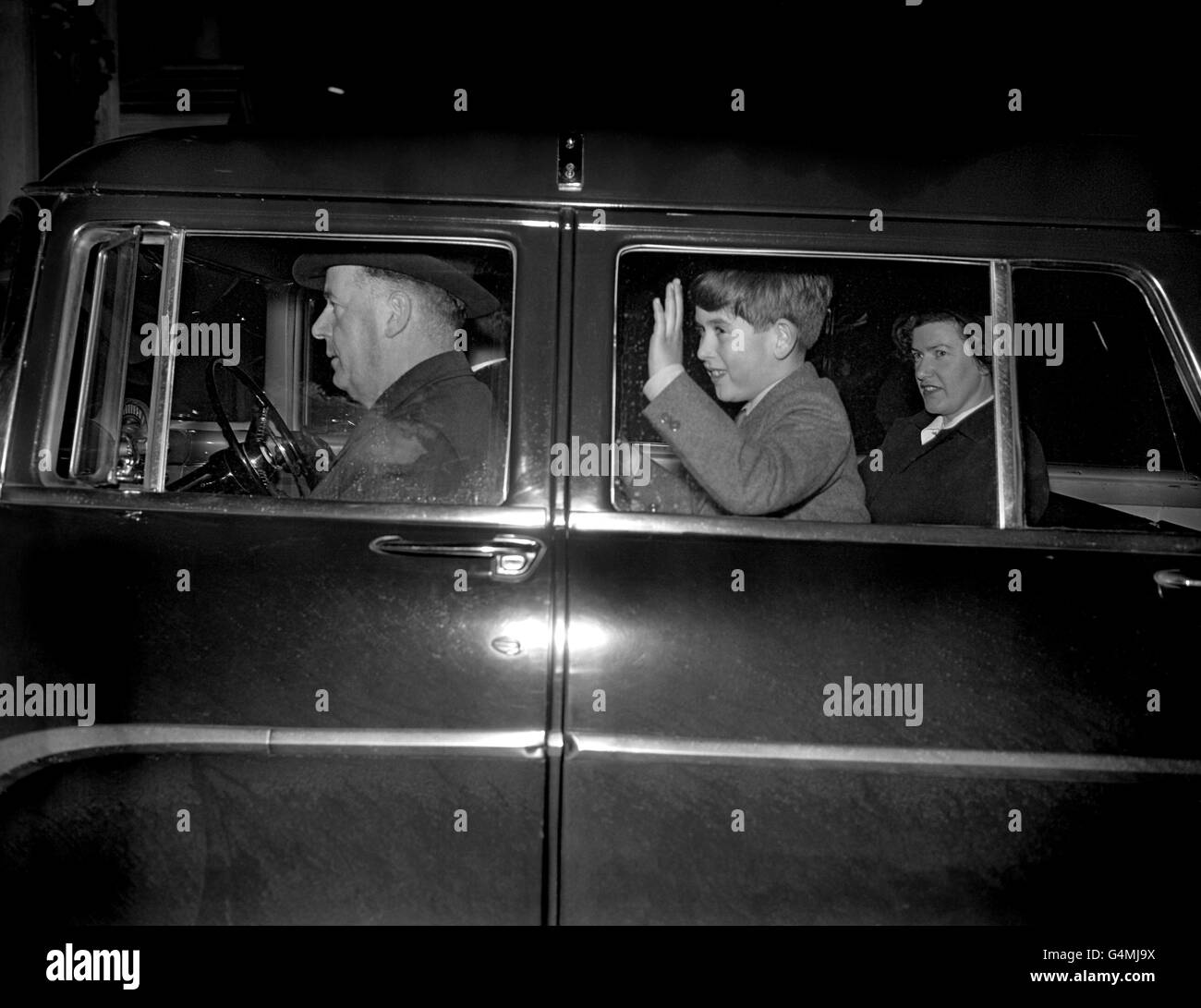 Prince Charles waves from the Royal car as he arrives at Buckingham ...