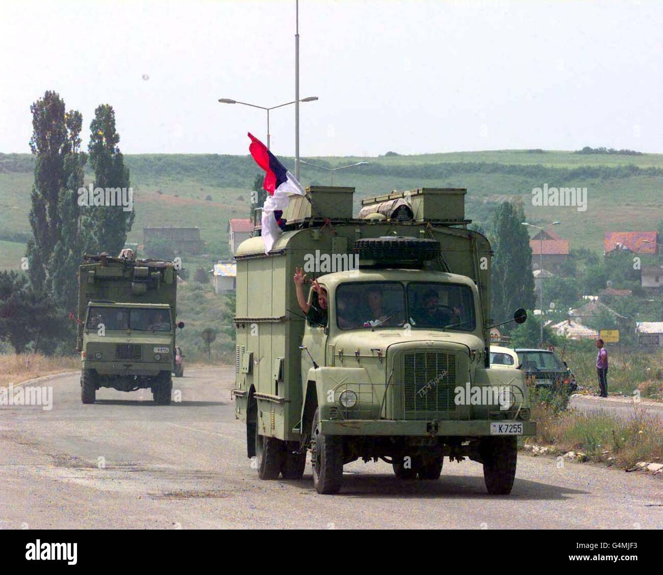 Serbian soldiers wave the three fingered victory sign hi-res stock ...