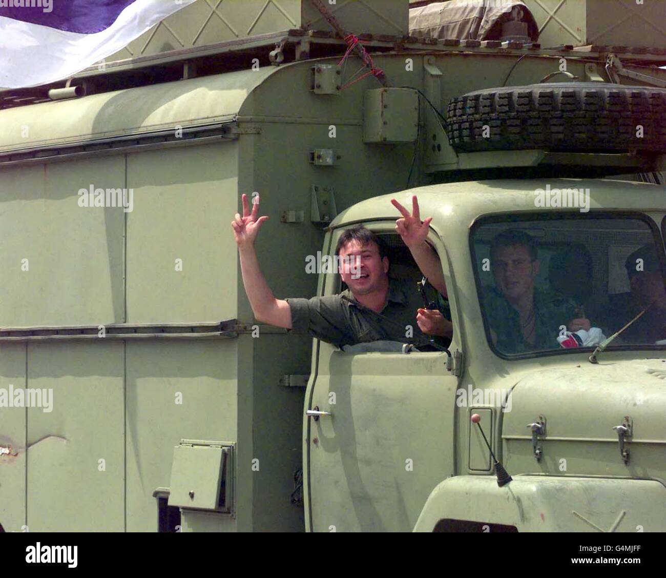 Serbian soldiers wave the three fingered victory sign hi-res stock ...