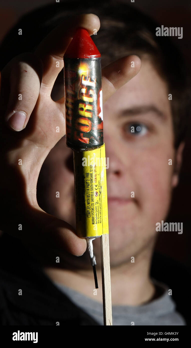 A generic stock photograph showing a man holding a firework ahead of ...