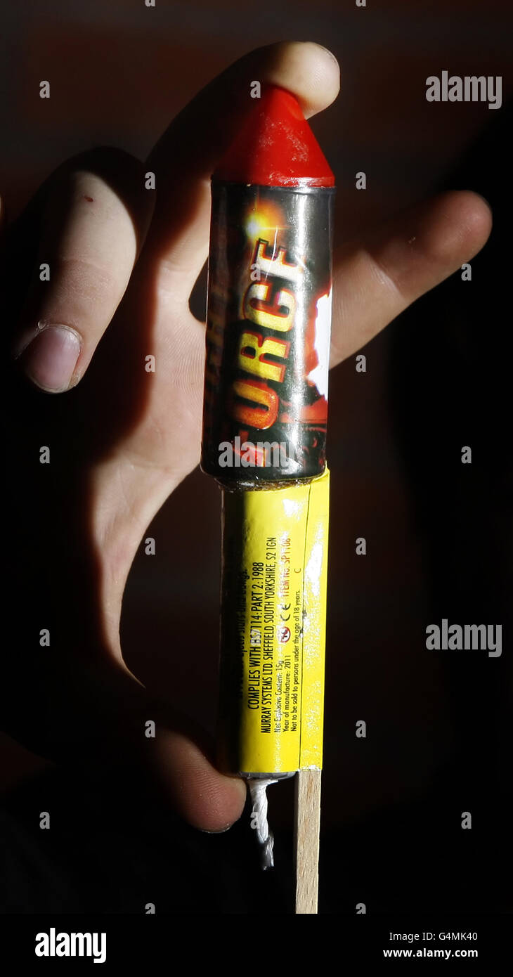 A generic stock photograph showing a man holding a firework ahead of ...