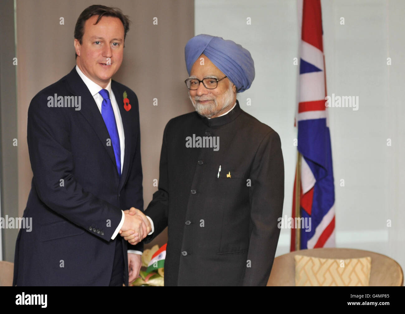 Britain's Prime Minister David Cameron shakes hands with India's Prime ...