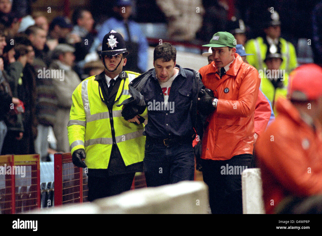 A hooligan is led away by the Police after being arrested Stock Photo ...