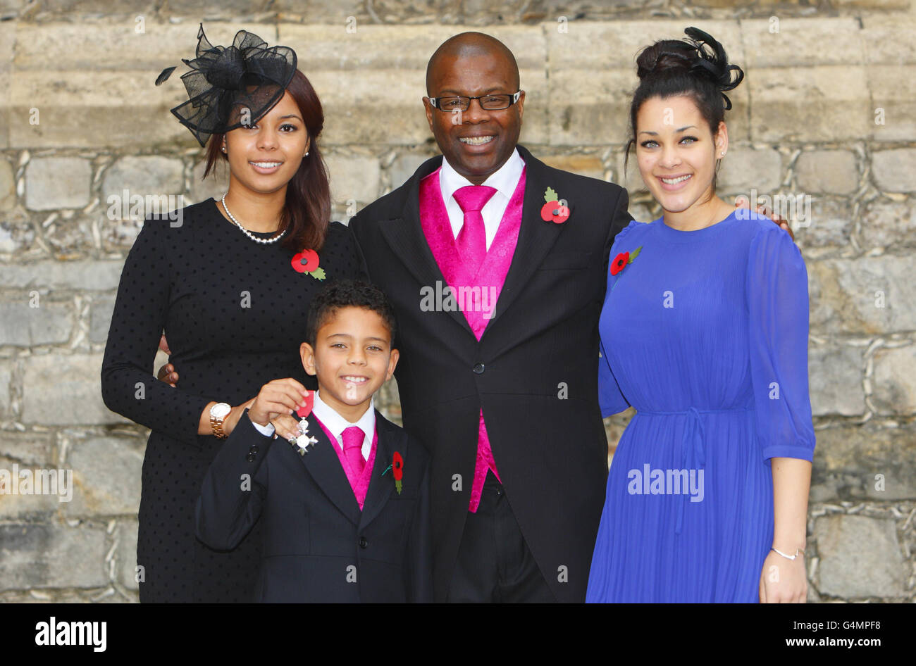 Former boxer Duke McKenzie poses with his children Jessica (left ...