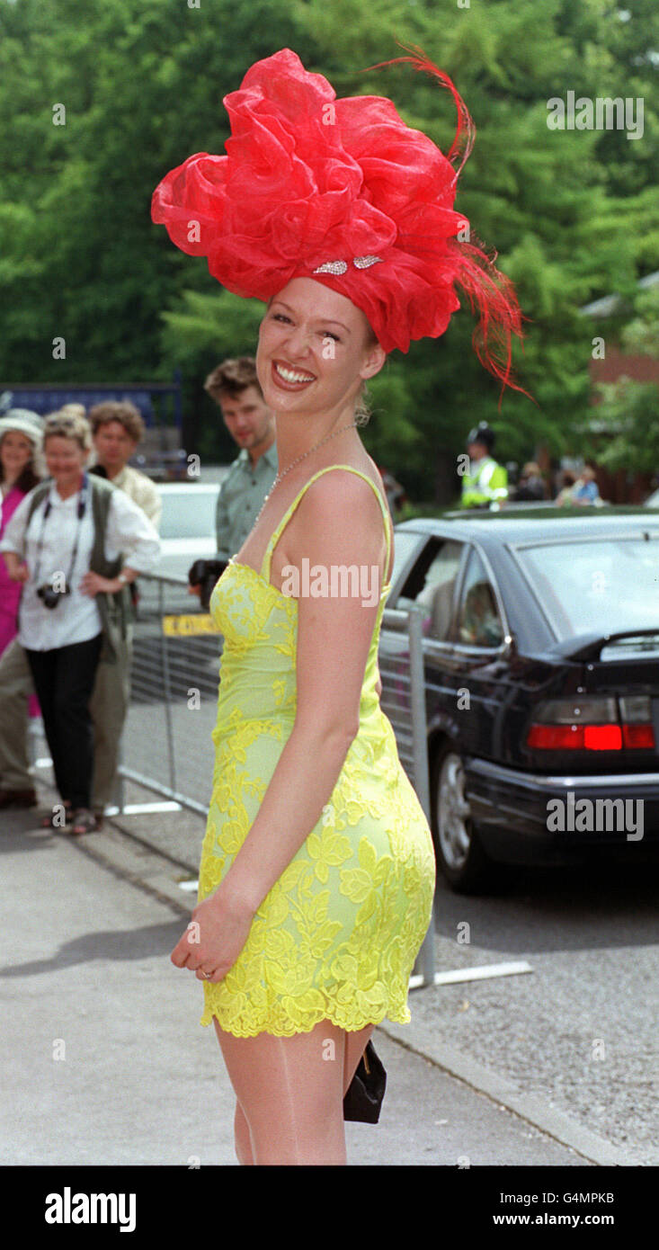A female race fan dresses up for the occasion, wearing an elaborately ...