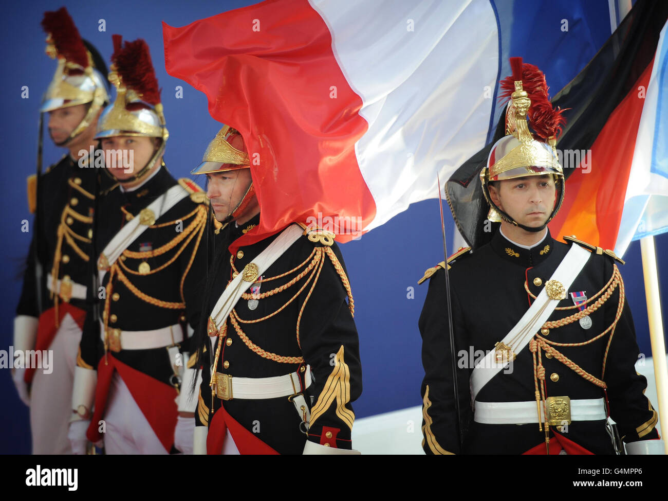 French soldiers stand guard outside the summit venue of this year's ...