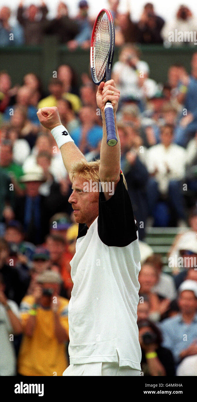 3 4 three quarter length portrait profile arm raised celebrating sport ...